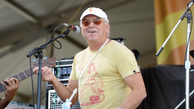 Watch Flight Attendant Makes Sweet Attempt To Get Passengers To Pay Tribute To Jimmy Buffett
